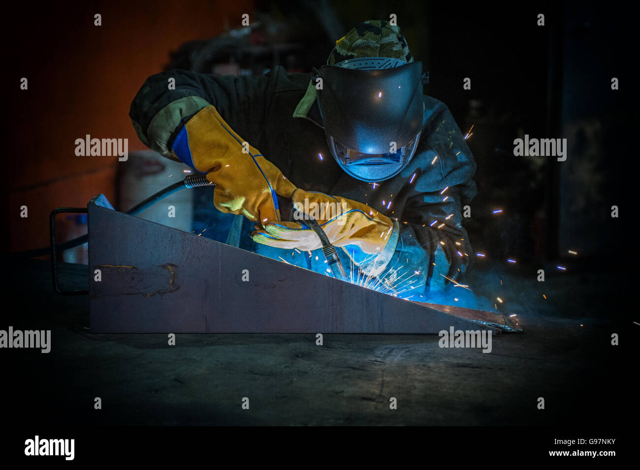 worker welding metal Stock Photo - Alamy
