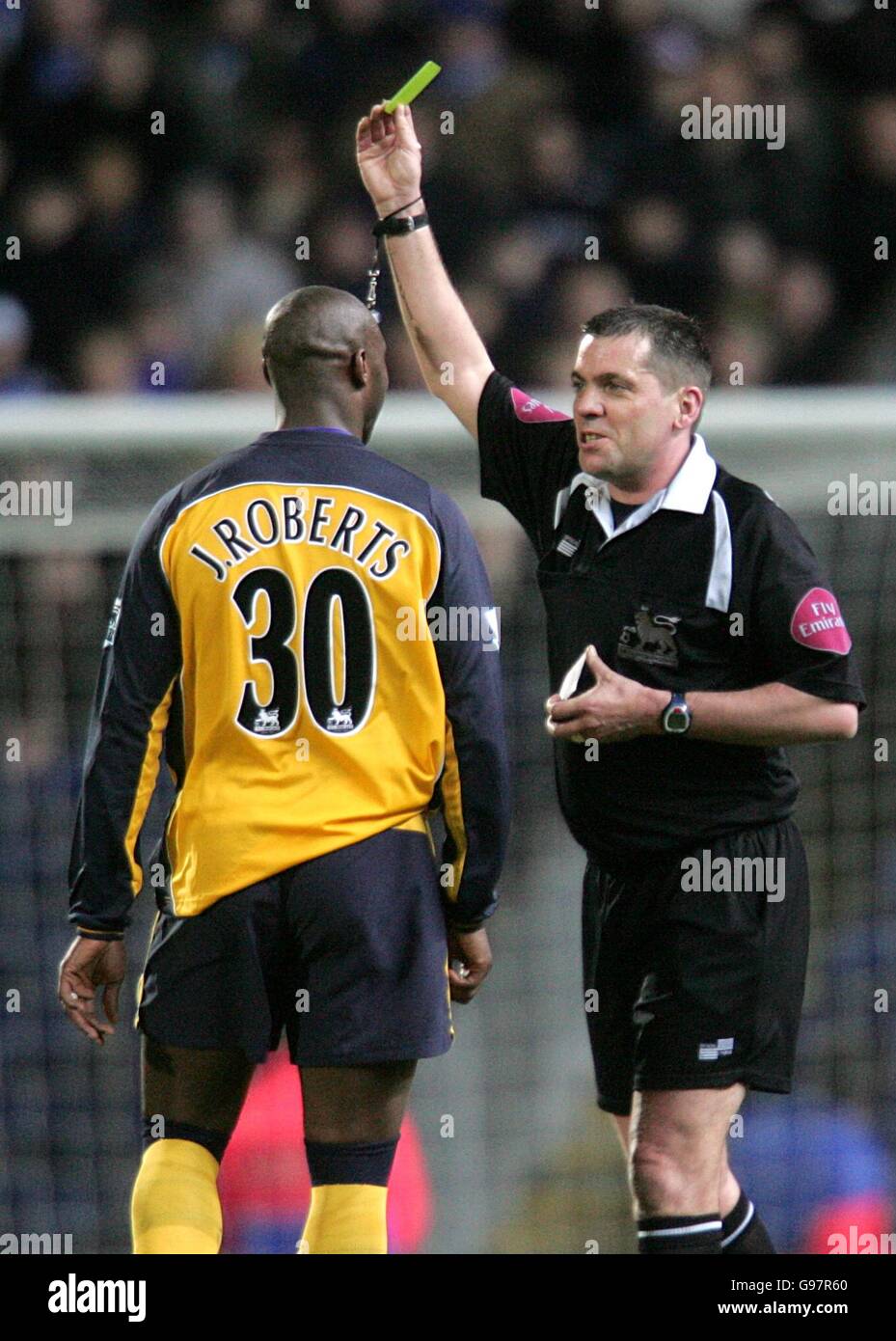 Referee Phil Dowd books Wigan Athletic's Jason Roberts Stock Photo - Alamy
