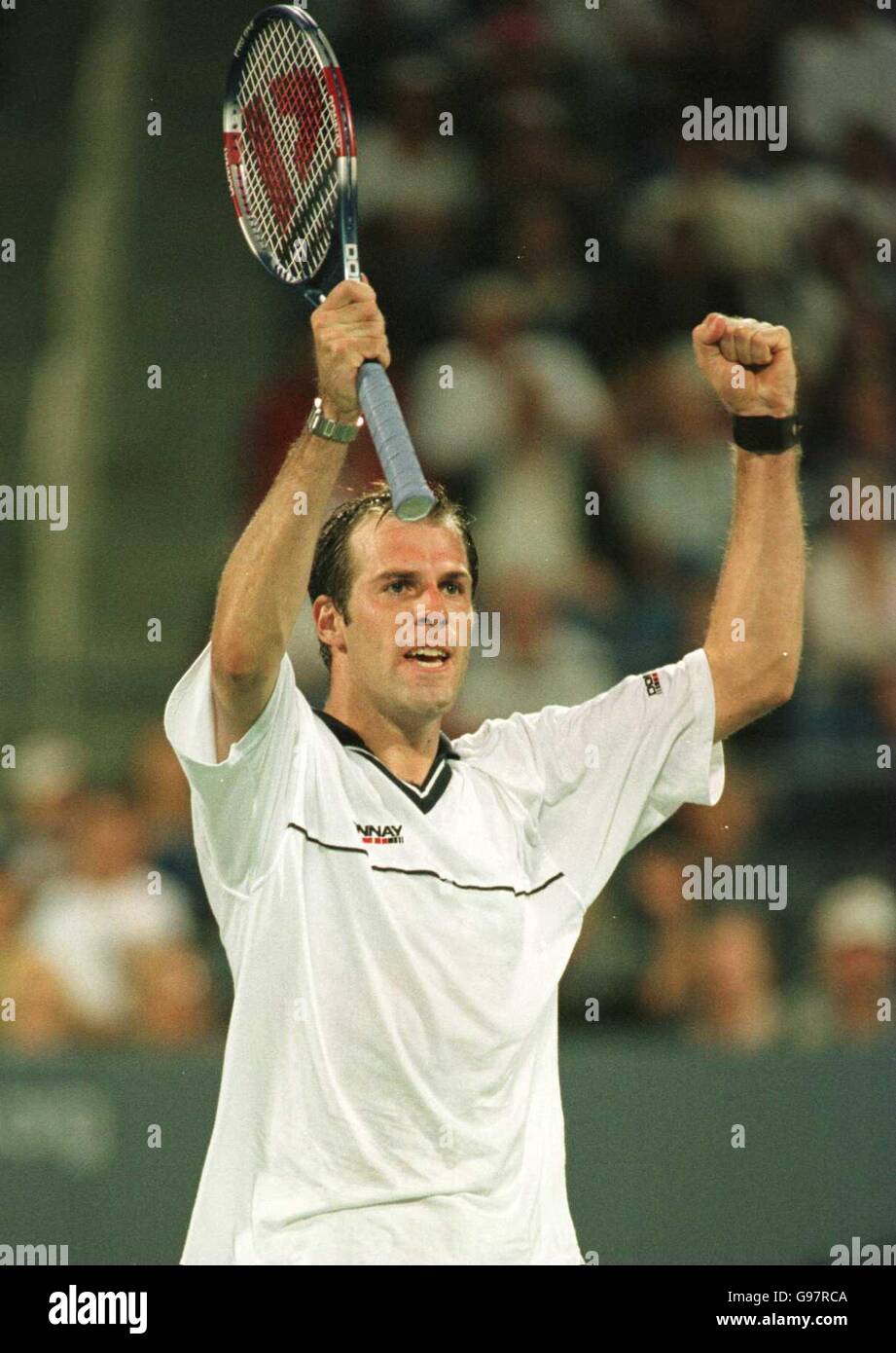 Greg Rusedski celebrates his victory over Chris Woodruff as he ...