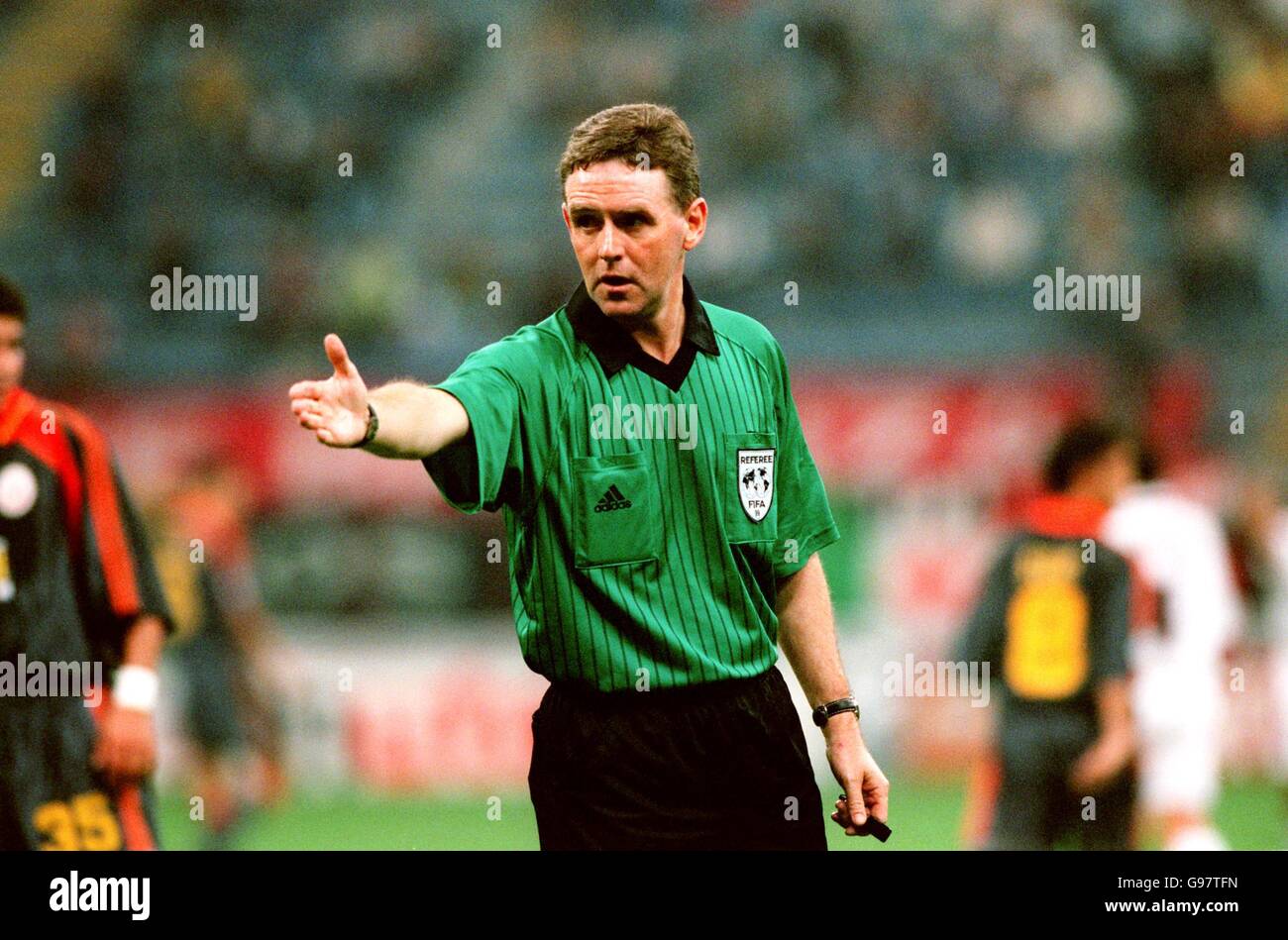 Referee hugh dallas points for a goal kick hi-res stock photography and ...