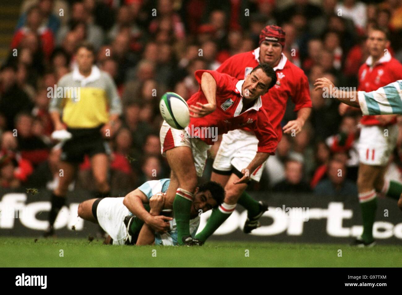 Shane Howarth, Wales manages to release the ball before being takled ...