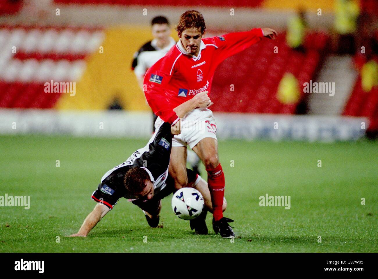 L-R; Barnsley's Adrian Moses tackles Nottingham Forest's Man of the ...