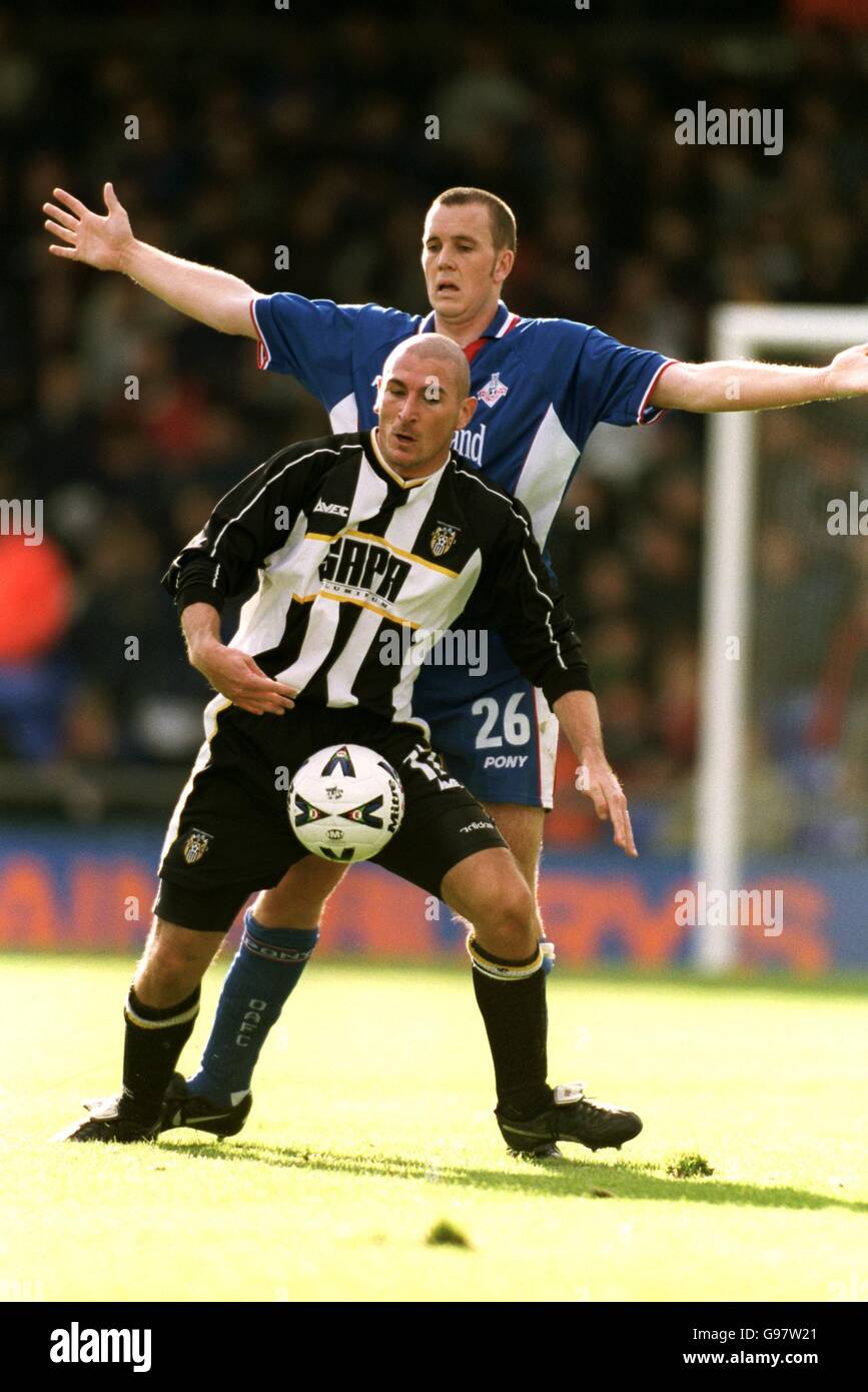 Notts County's Duane Darby (front) shields the ball from Oldham ...