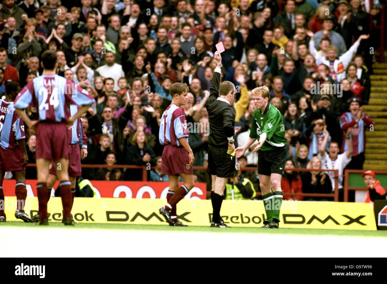 Liverpool's Steve Staunton (right) is sent off by referee Rob Harris ...