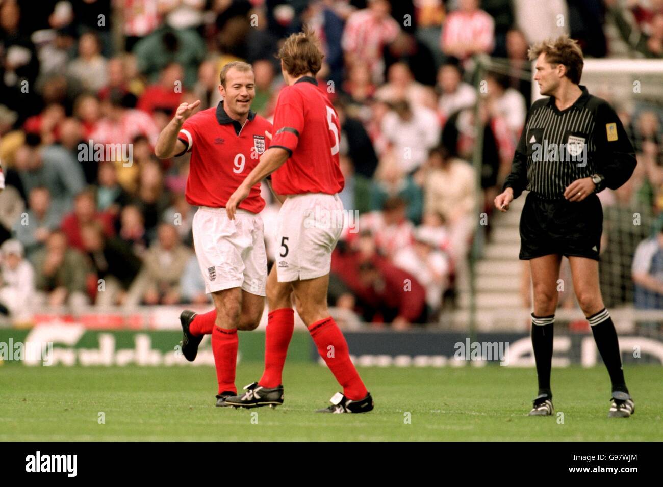 England's Alan Shearer celebrates with Tony Adams after he scores his ...