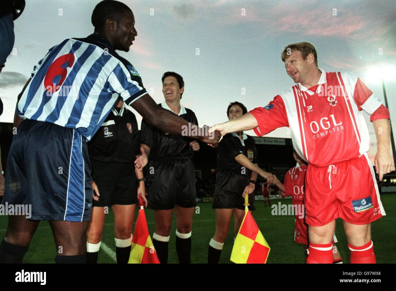 Kidderminster Harriers captain Paul Webb (right) shakes hands with his ...