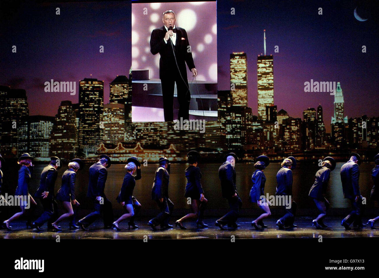 Frank Sinatra sings, accompanied by dancers and an orchestra in Sinatra ...
