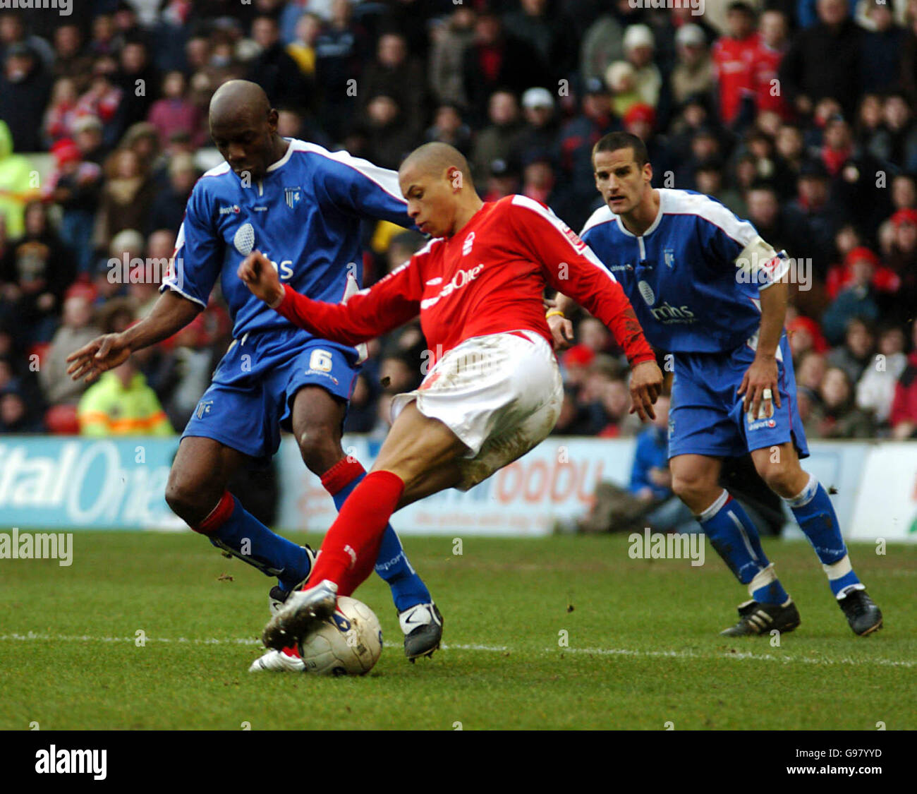 Nottingham Forest's Nathan Tyson and Gillingham's Ian Cox in action ...