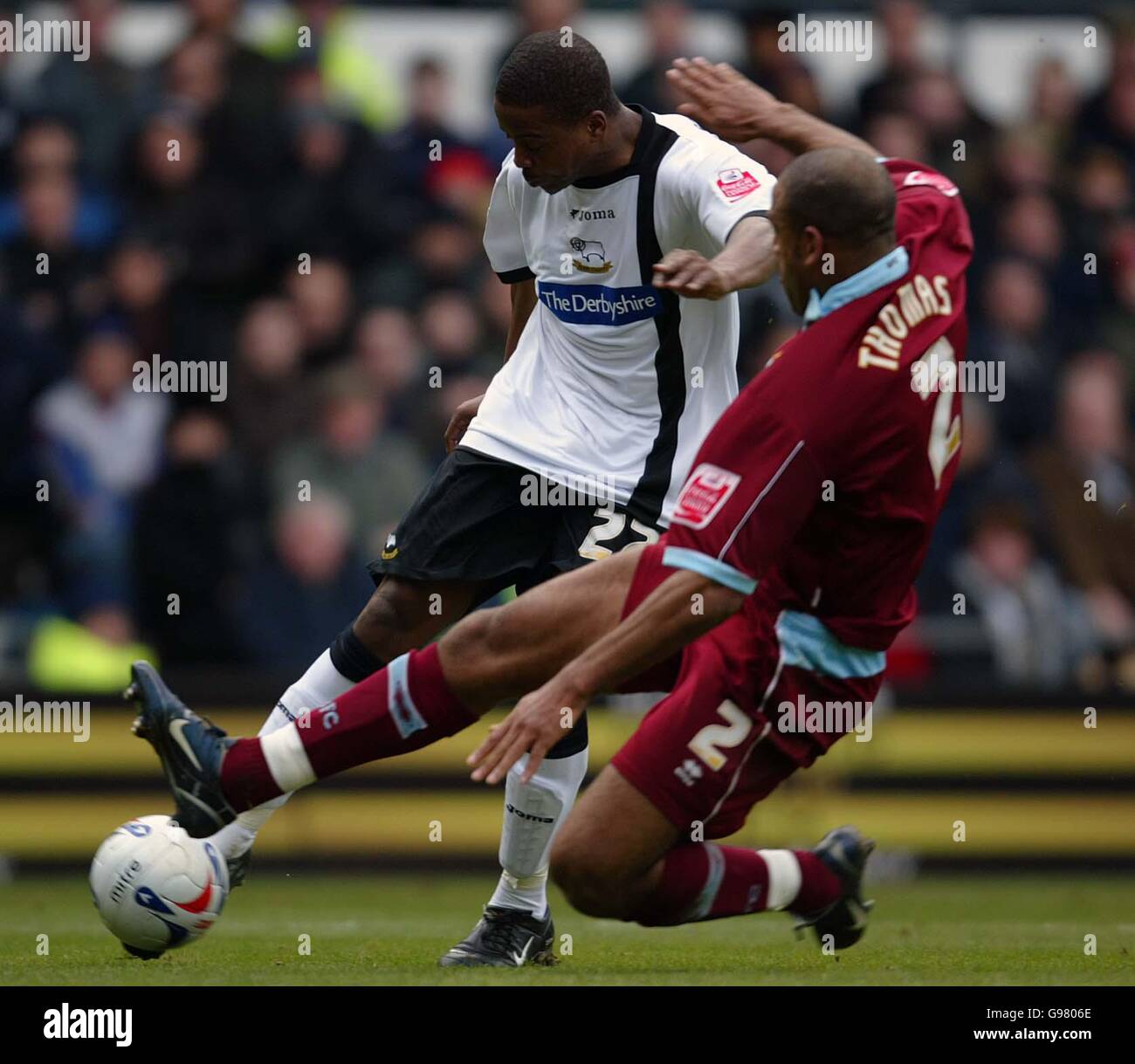 Derby County's Kevin Lisbie gets a shot in on goal despite the flying ...