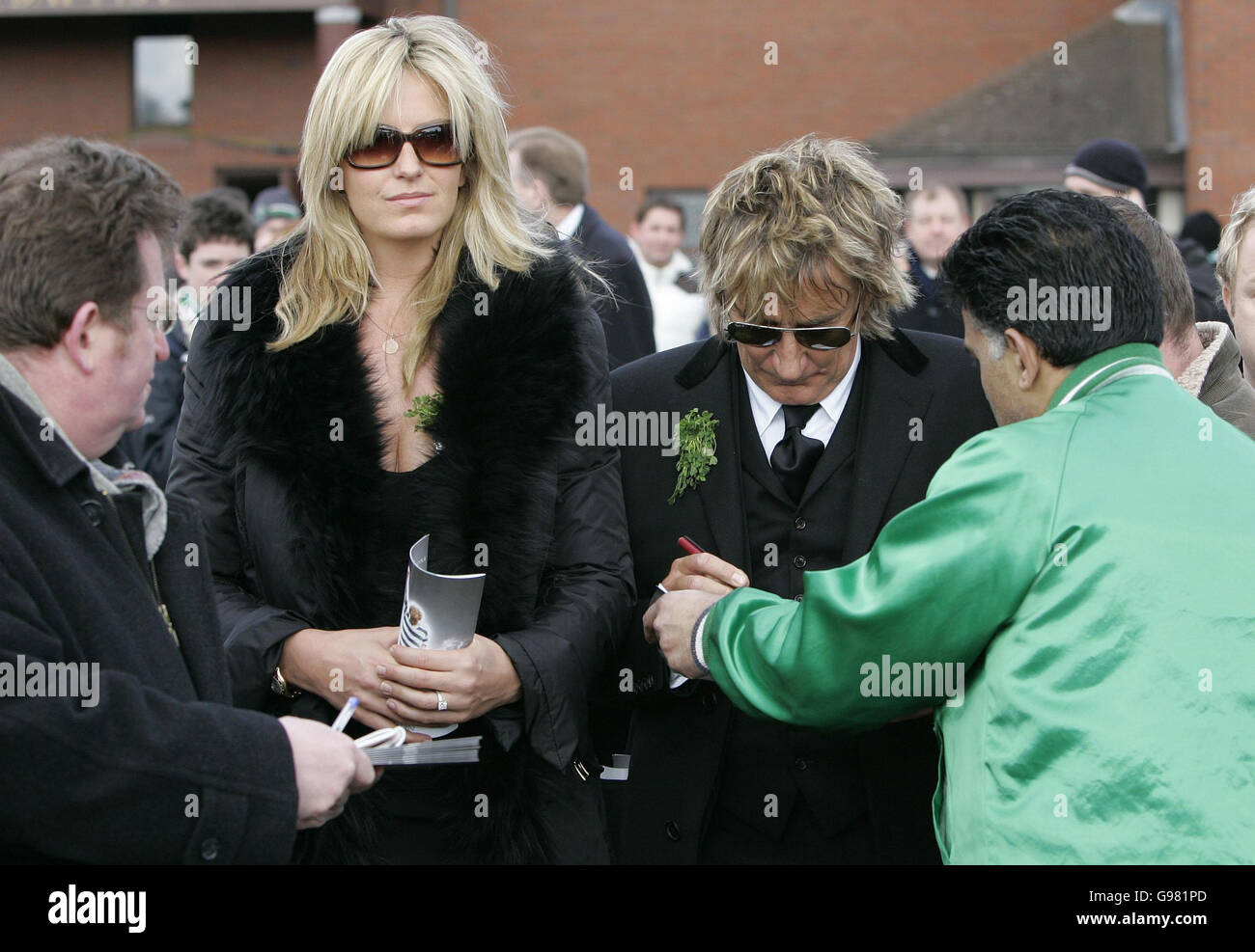 Rod Stewart and Penny Lancaster sign autographs at the funeral of Jimmy ...