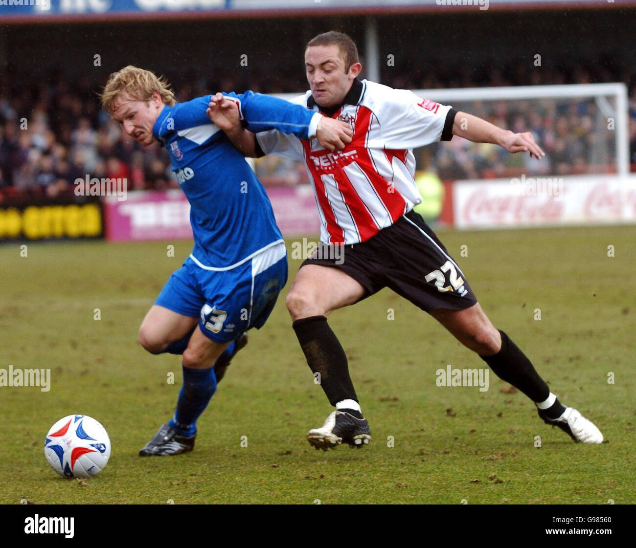 Cheltenham's John Melligan (R) challenges Rushden & Diamond's Marcus ...