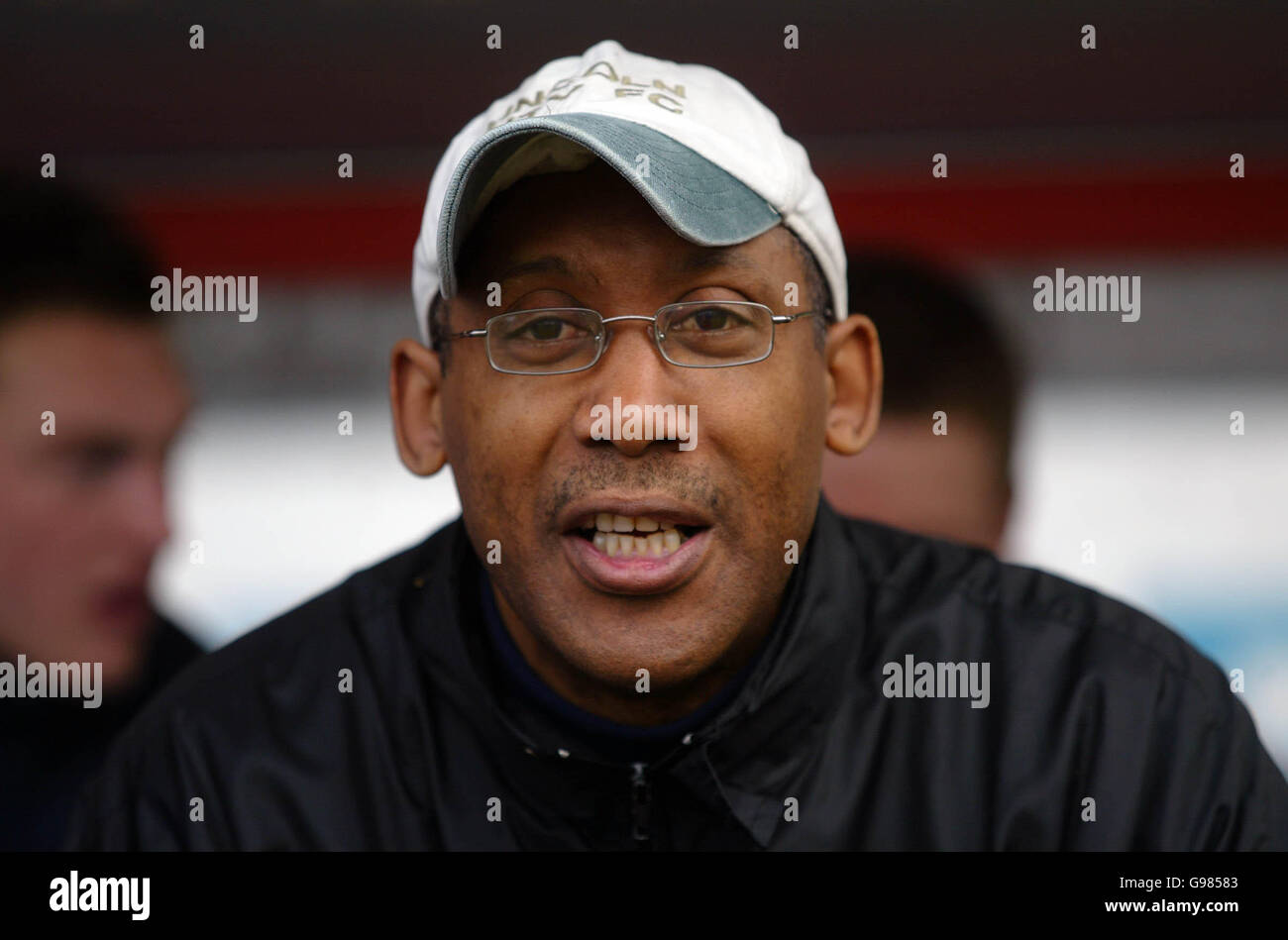Lincoln City's manager Keith Alexander looks happy dduring the game ...