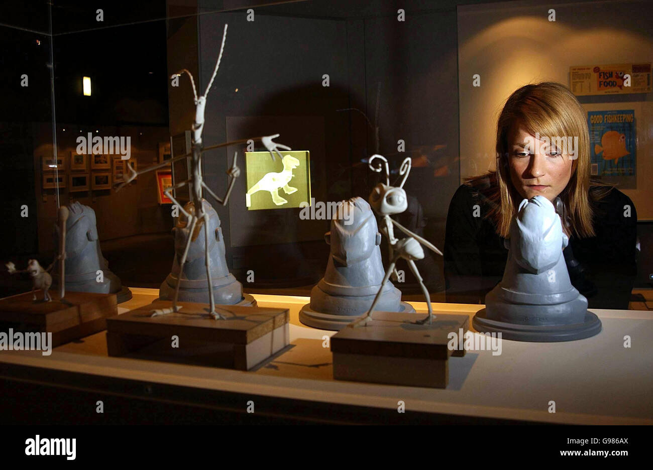 A science museum employee examines models bugs life science museum hi ...