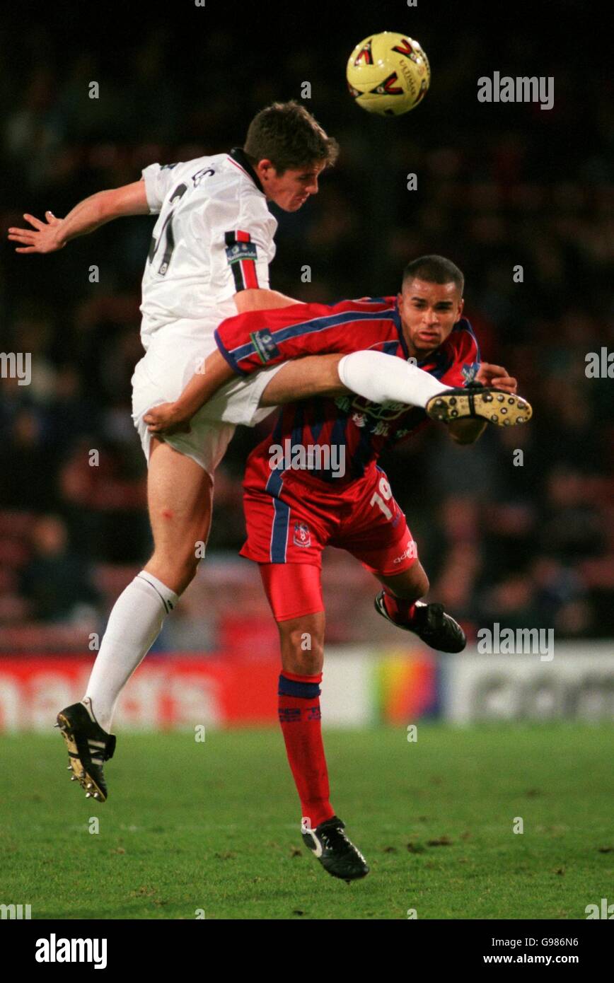 Nottingham Forest's Chris Doig (left) heads clear from Crystal Palace's ...