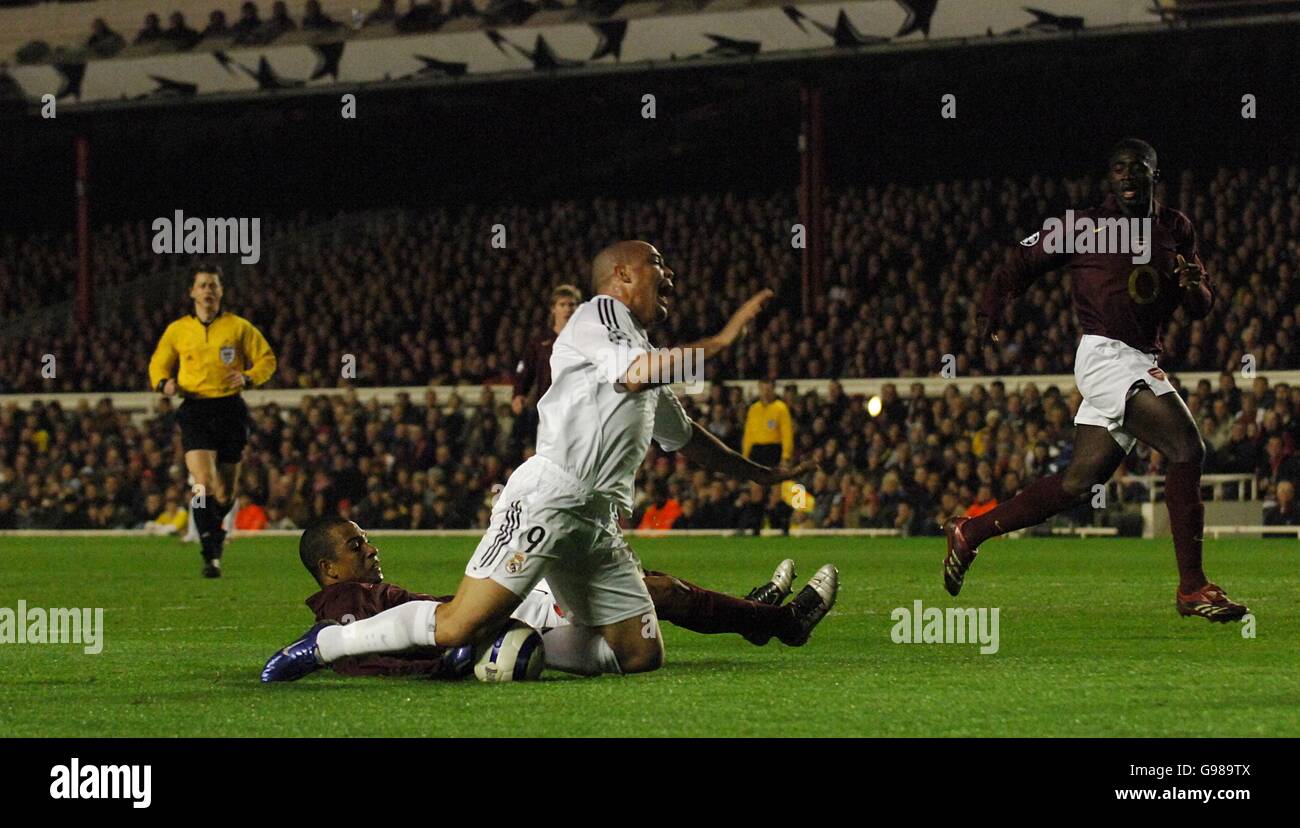 Arsenal's Gilberto Silva brings down Real Madrid Ronaldo in the box ...