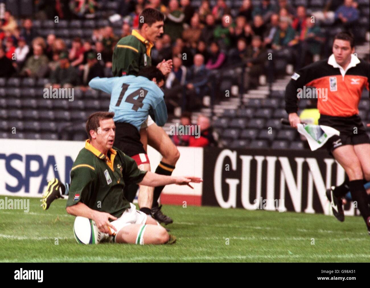 South Africa's Robbie Fleck goes over to score the first try against ...