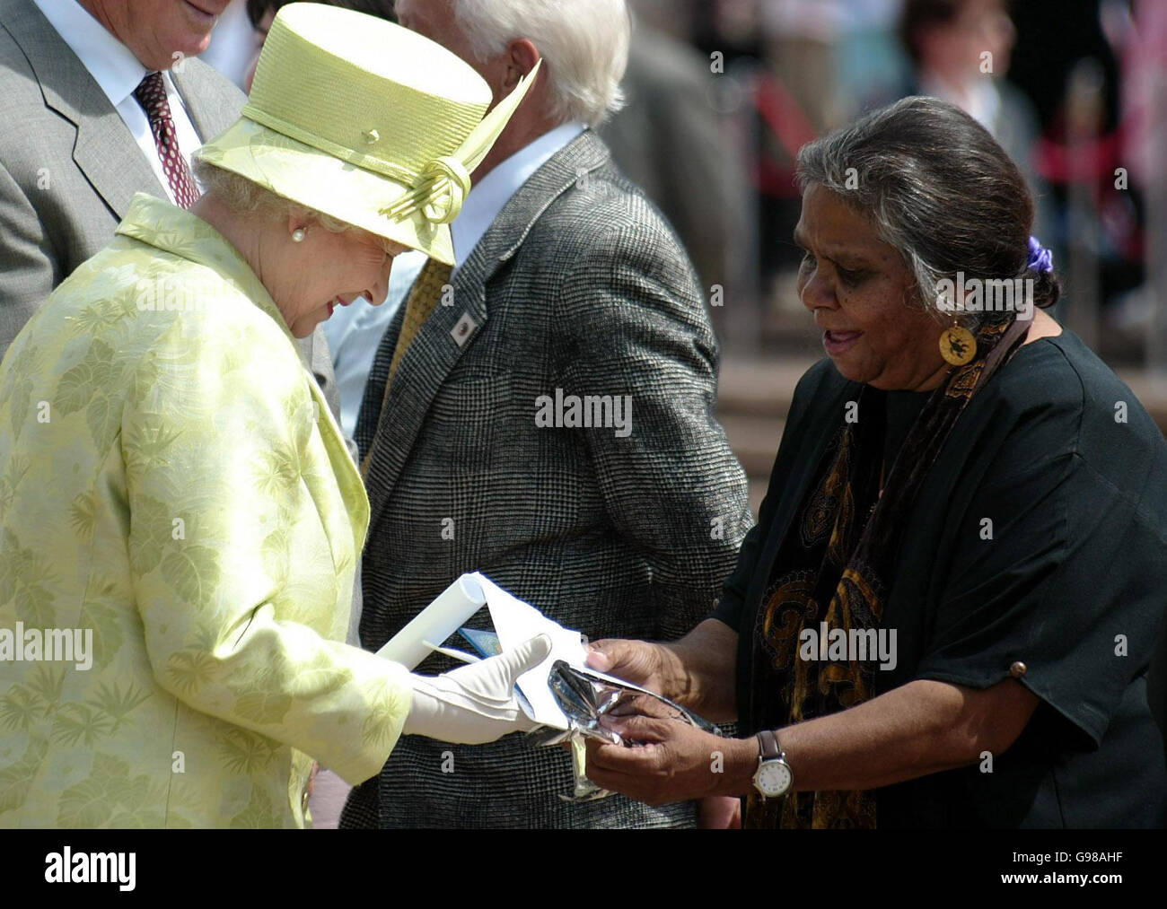 Queen Elizabeth II is given a message stick by Ali Golding during the ...