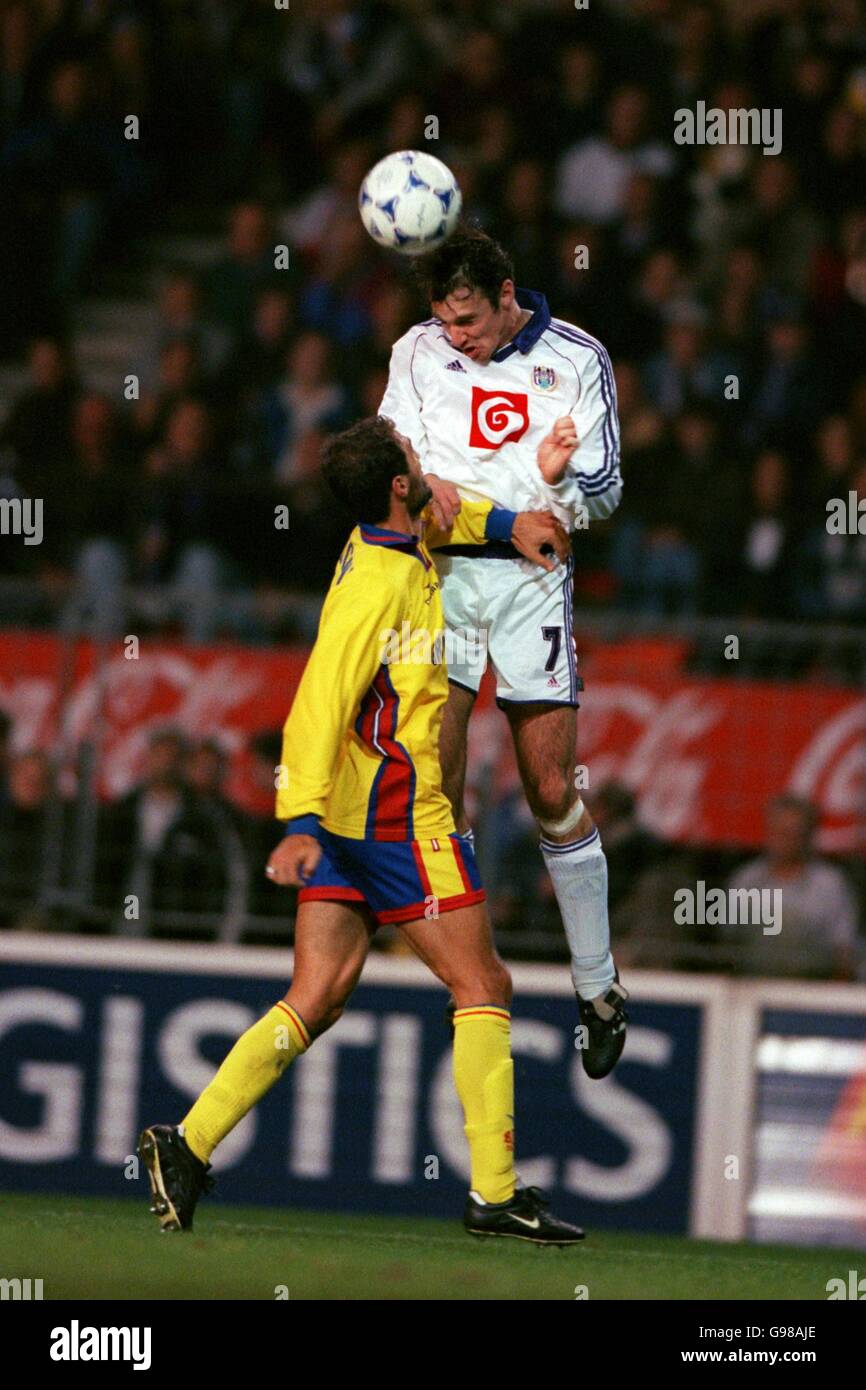 Anderlecht's Bart Goor (right) heads clear from Bologna's Giulio ...