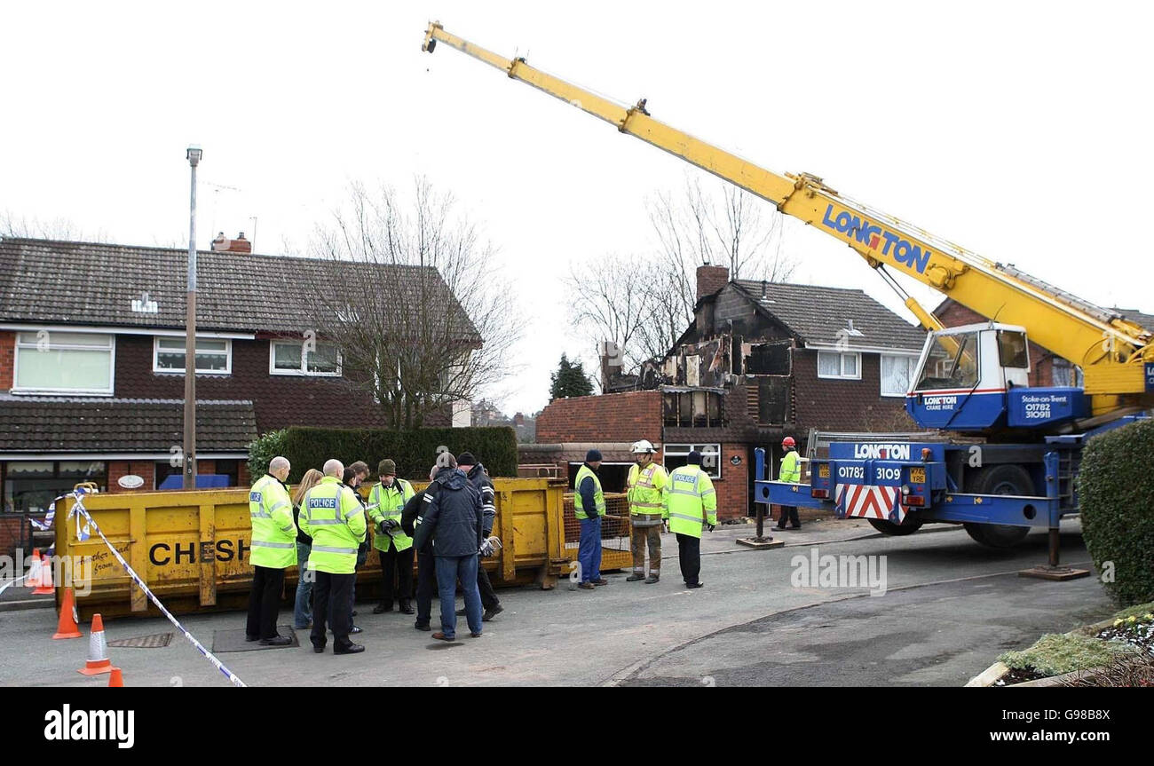 Police demolition workers at the devastated house in hillside road hi ...