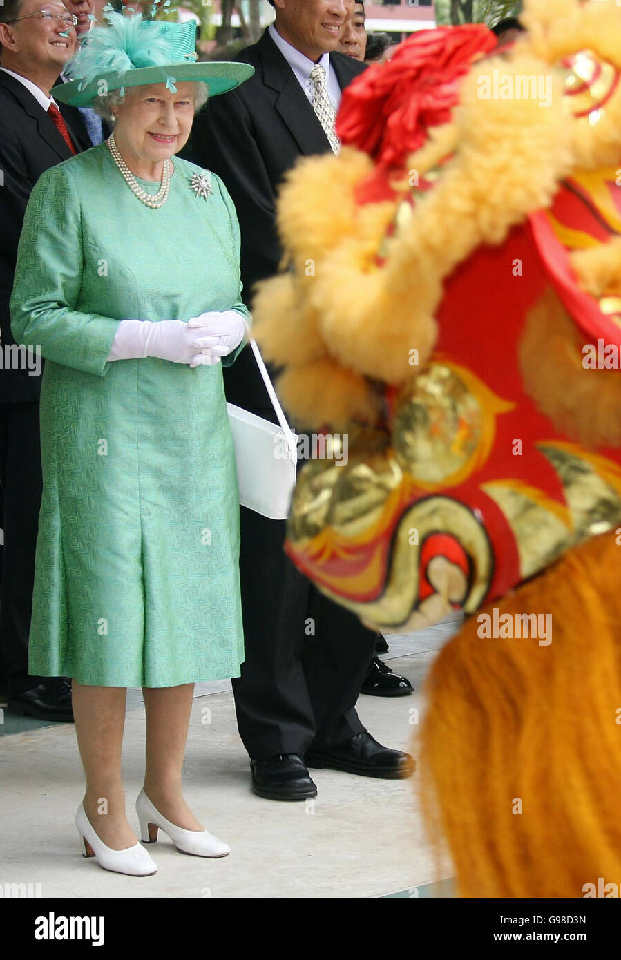 Britain's Queen Elizabeth II is welcomed to the Toa Payoh housing ...