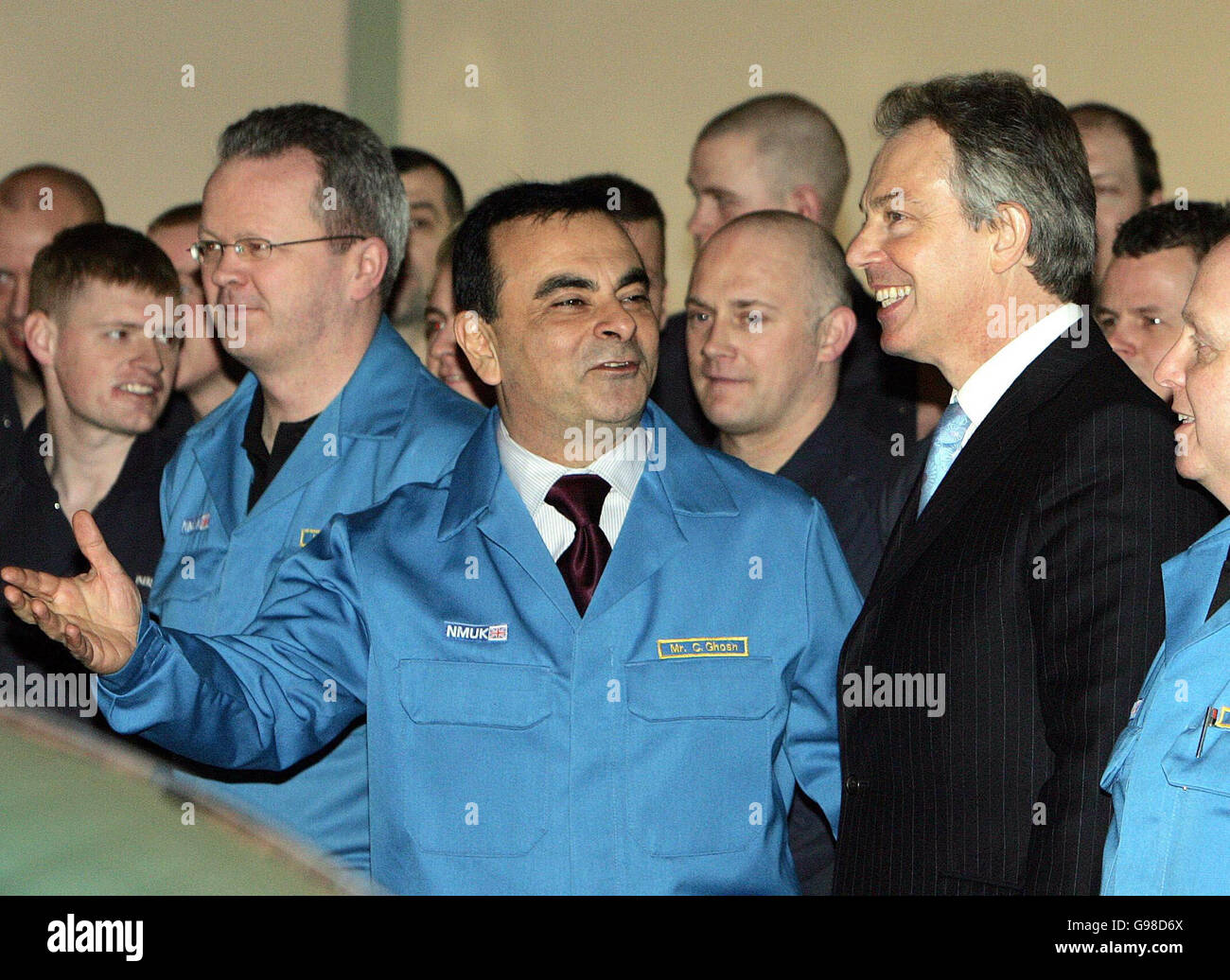 Nissan President Carlos Ghosn shows Prime Minister Tony Blair the new ...