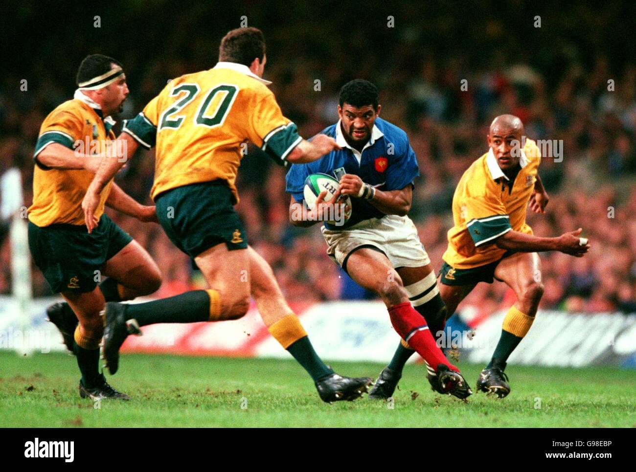 France's Emile Ntamack (second right) is surrounded by Australia's ...