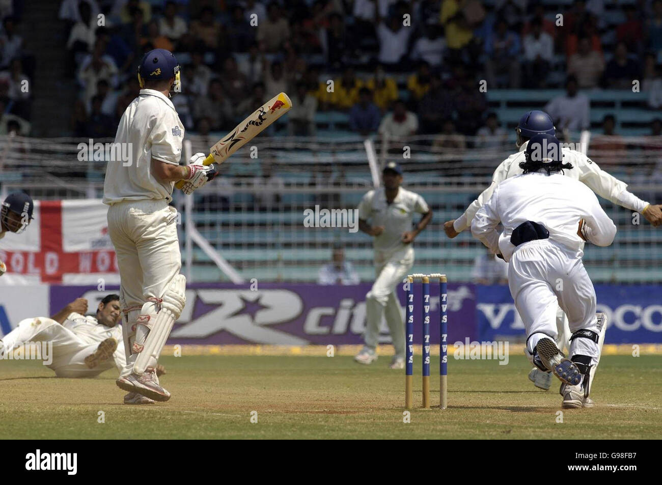 Indian bowler Anil Kumble lies on the wicket after caught and bowling ...