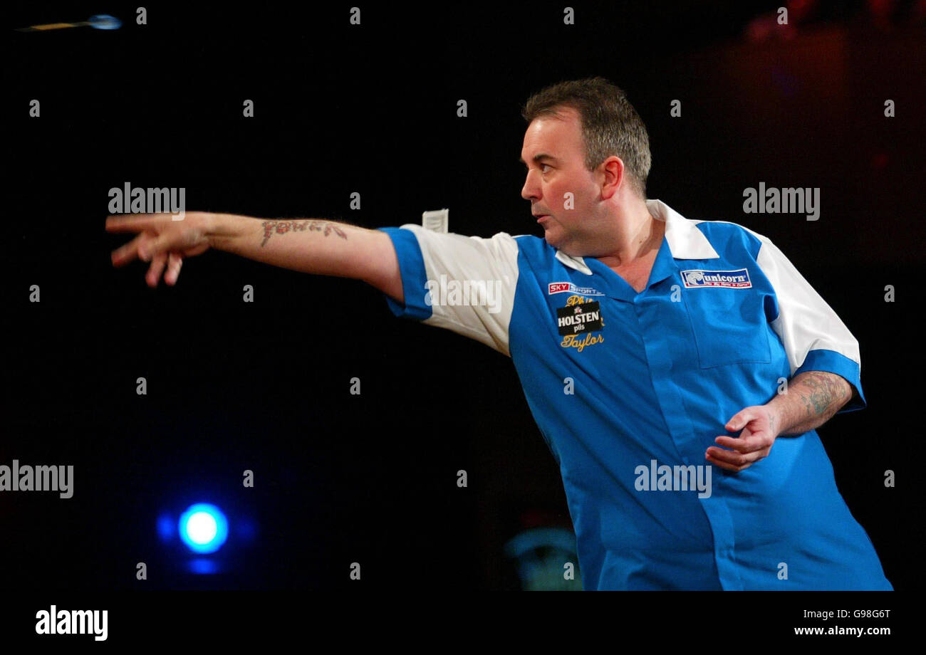 Phil Taylor in action against Raymond van Barneveld during the Holsten ...