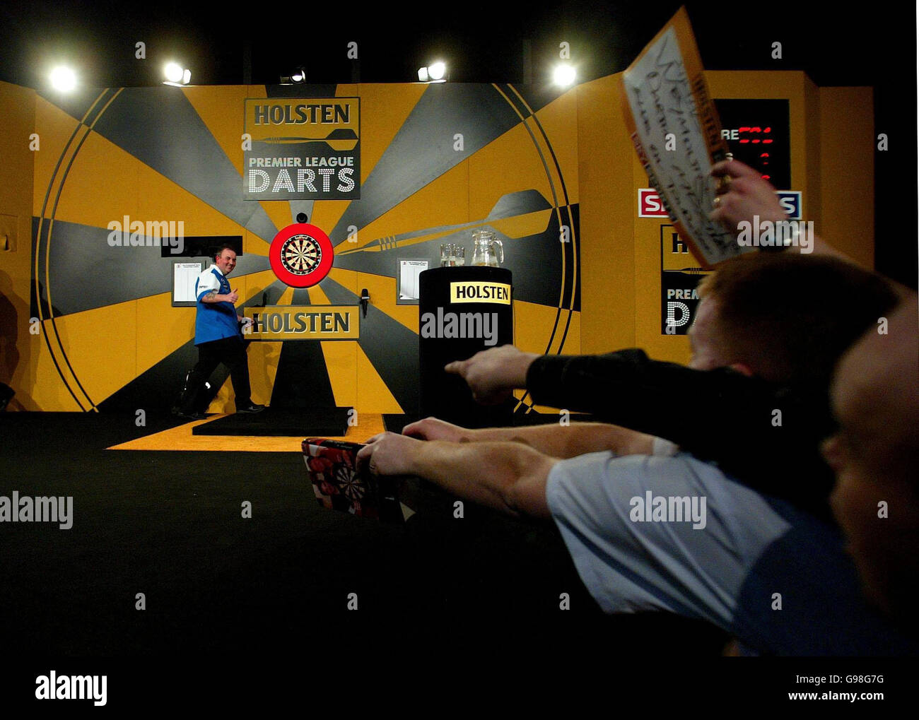 Fans ask for Phil Taylor's (L) autograph following his Holsten Premier ...