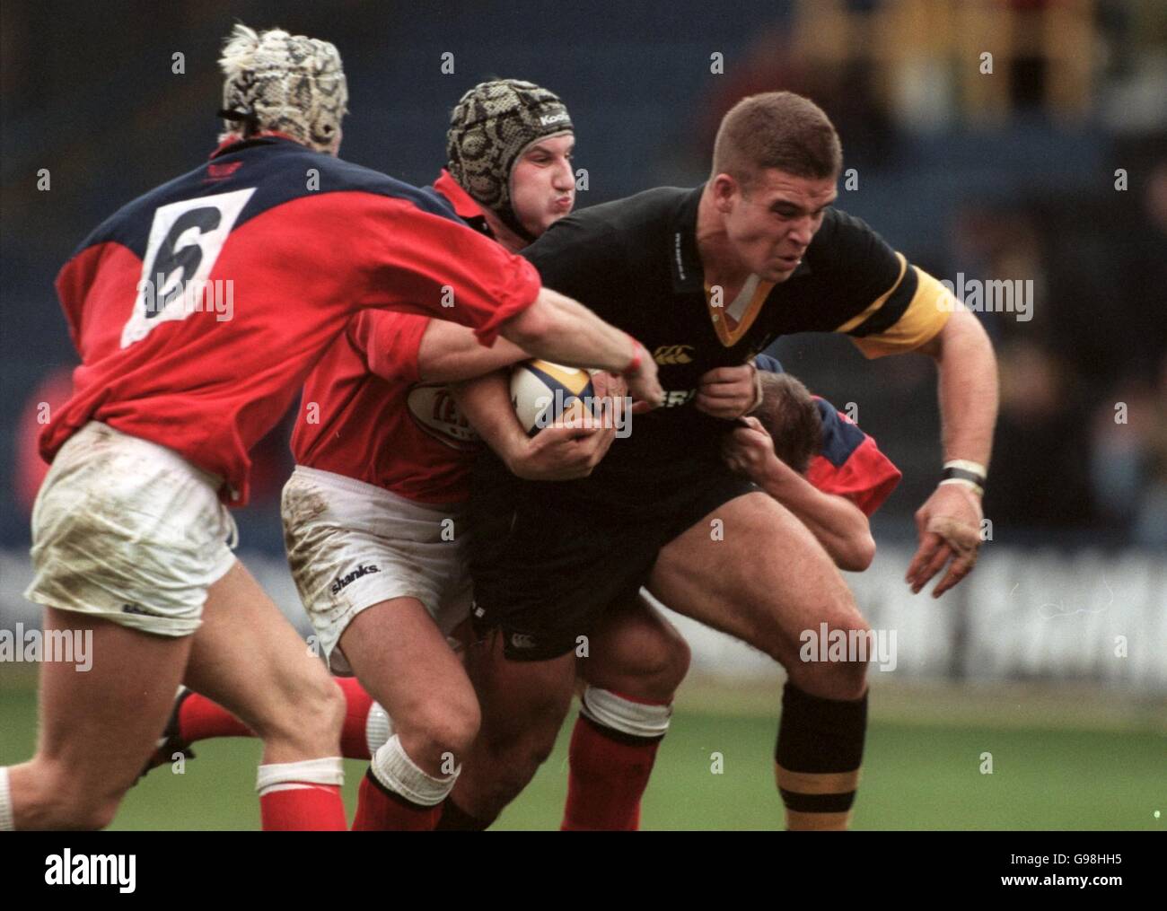 Wasps' Joe Worsley is tackled by Neil Boobyer and Simon Easterby Stock ...