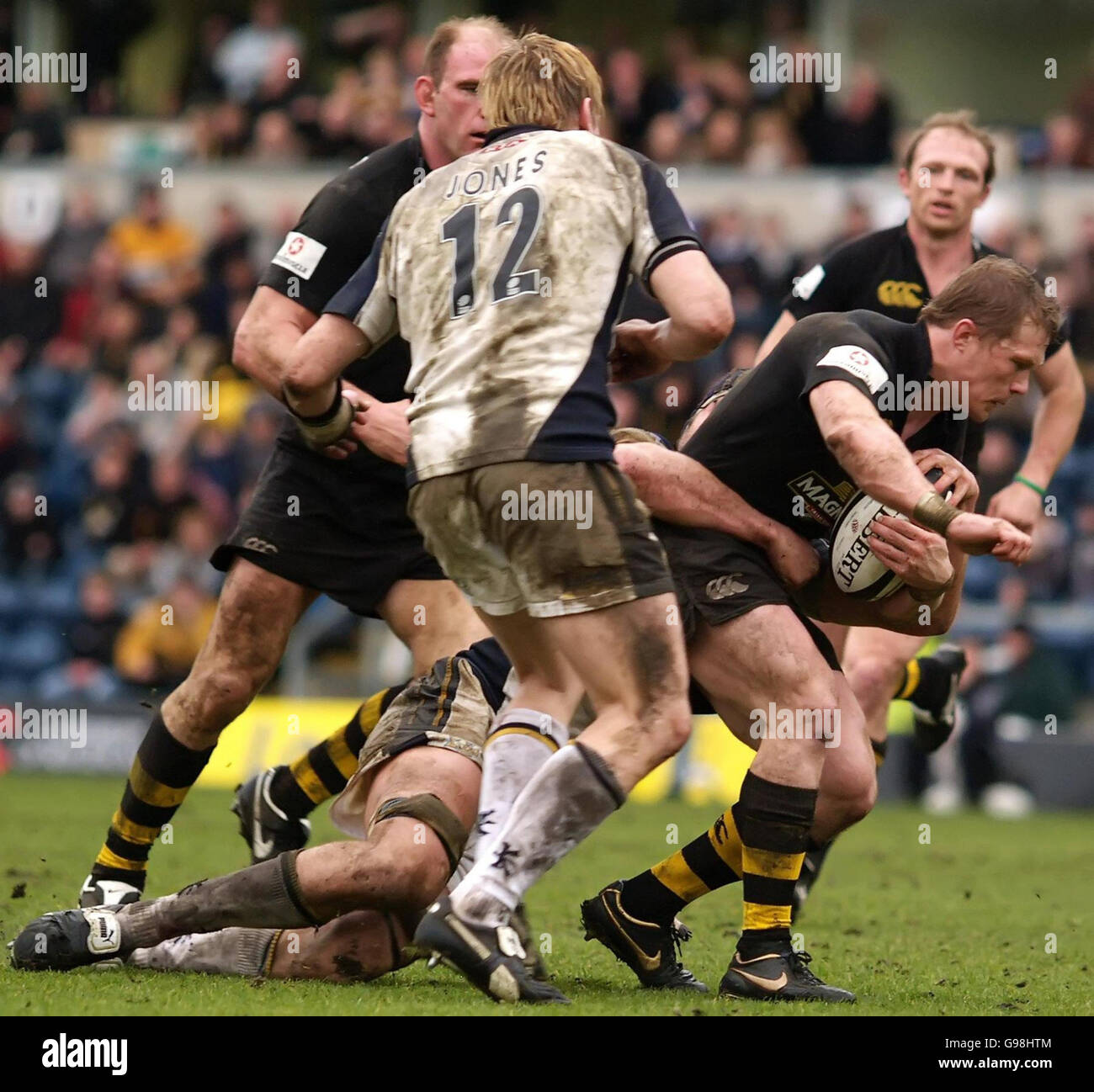London Wasps Josh Lewsey (R) breaks out of a tackle against Leeds Tykes ...