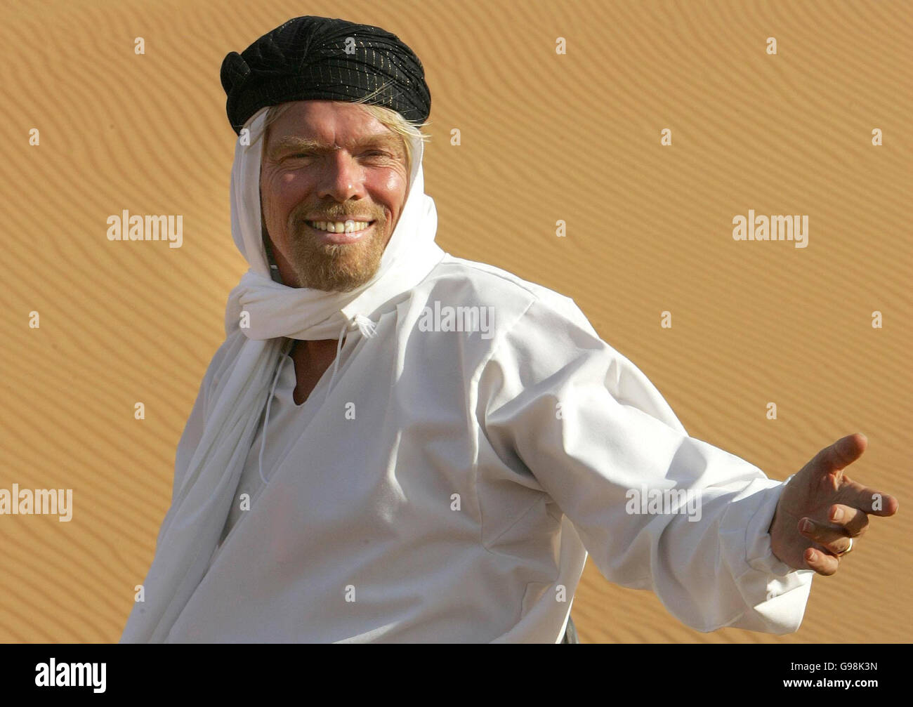 Sir Richard Branson rides a camel in the Dubai desert on Wednesday ...
