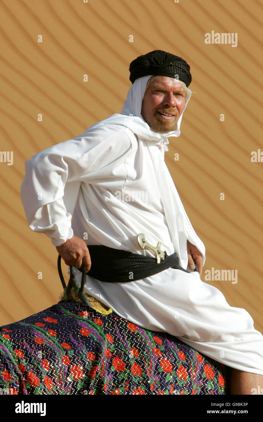 Sir Richard Branson rides a camel in the Dubai desert on Wednesday ...