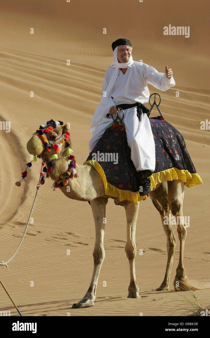 Sir Richard Branson rides a camel in the Dubai desert on Wednesday ...