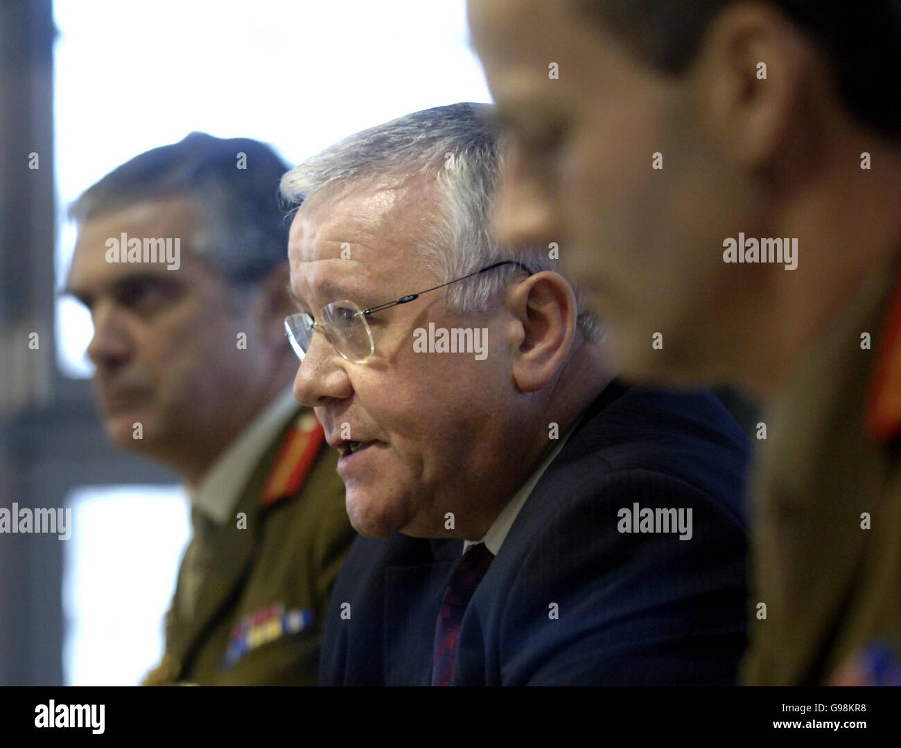 Minister for the Armed Forces Rt Hon Adam Ingram MP (centre) flanked by ...