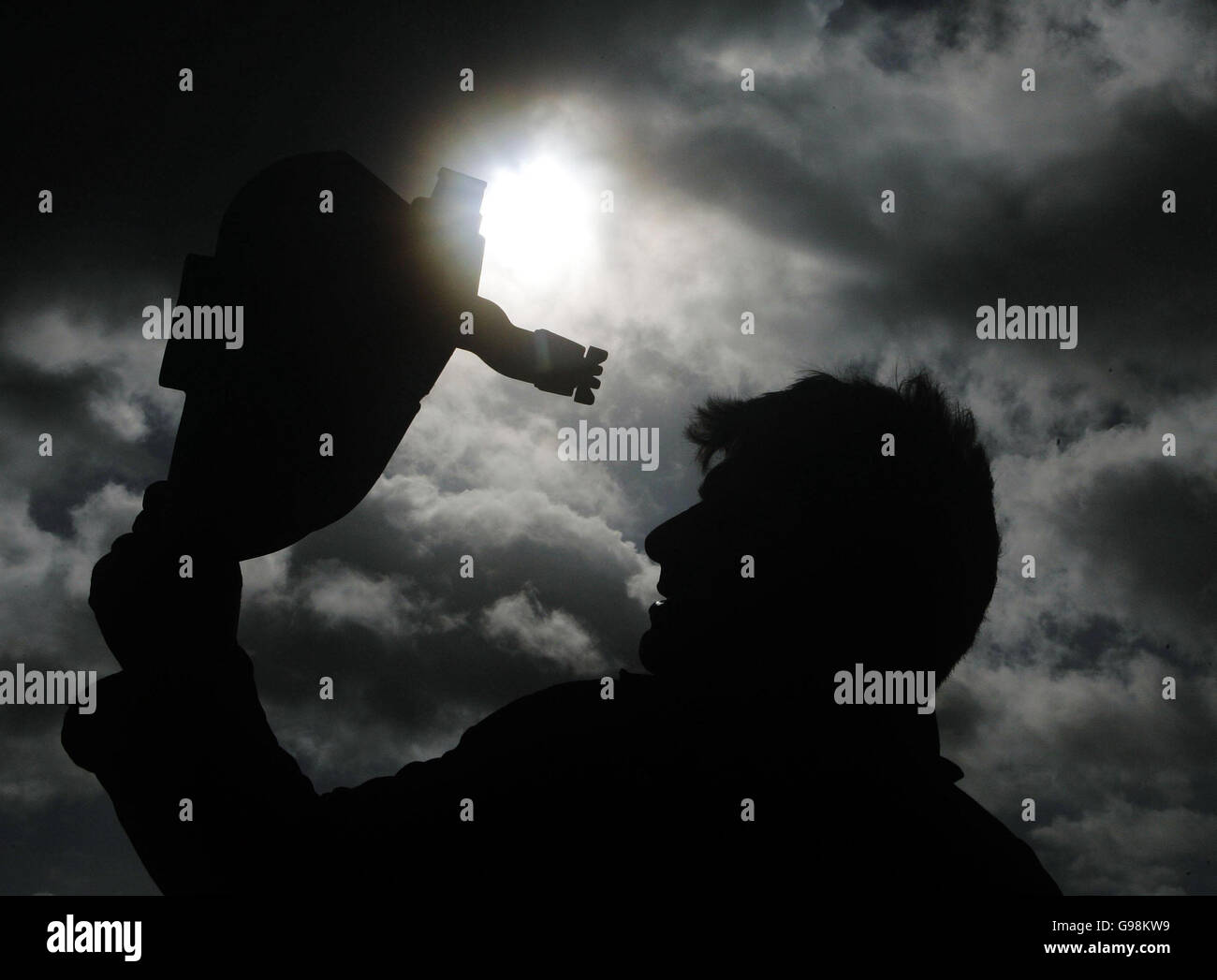A welder waits for a gap in the clouds to view tha partial solar ...