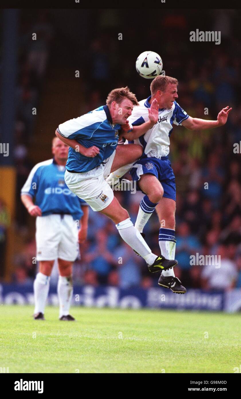 Manchester City's Jamie Pollock (left) challenges Bury's Ian Lawson ...