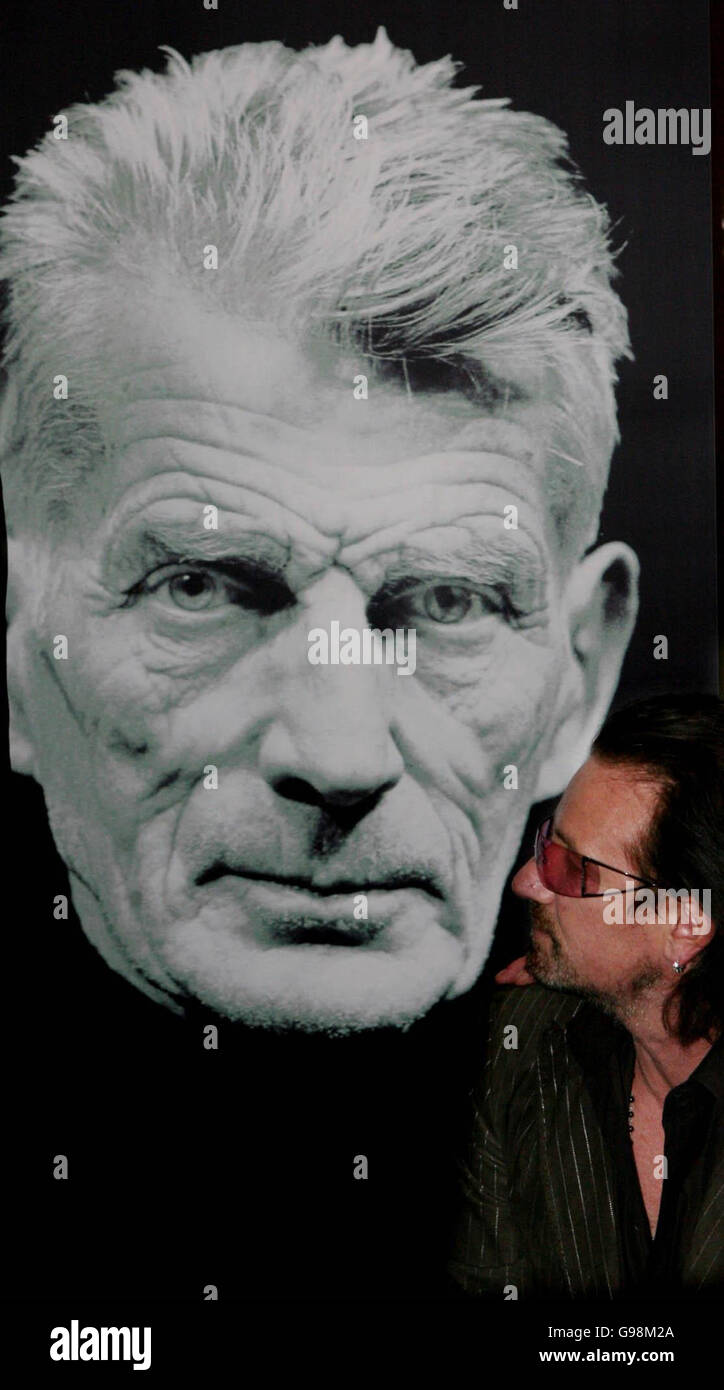 U2 lead singer Bono stands beside a portrait Thomas Beckett at the ...