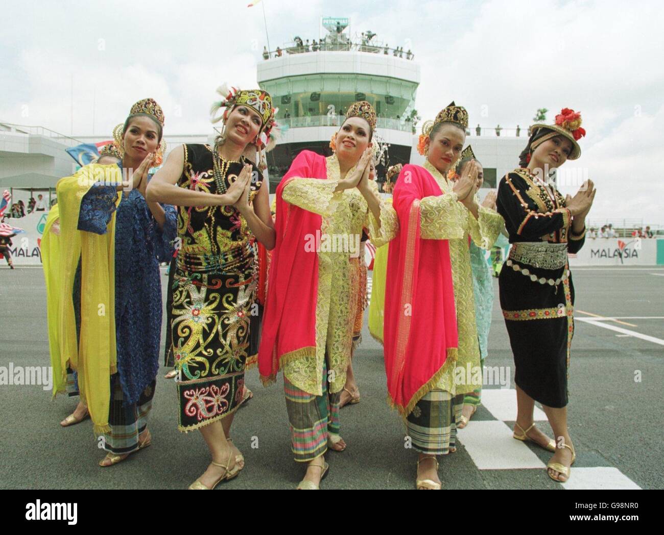 Formula One Motor Racing - Malaysian Grand Prix. Malaysian dancers on ...
