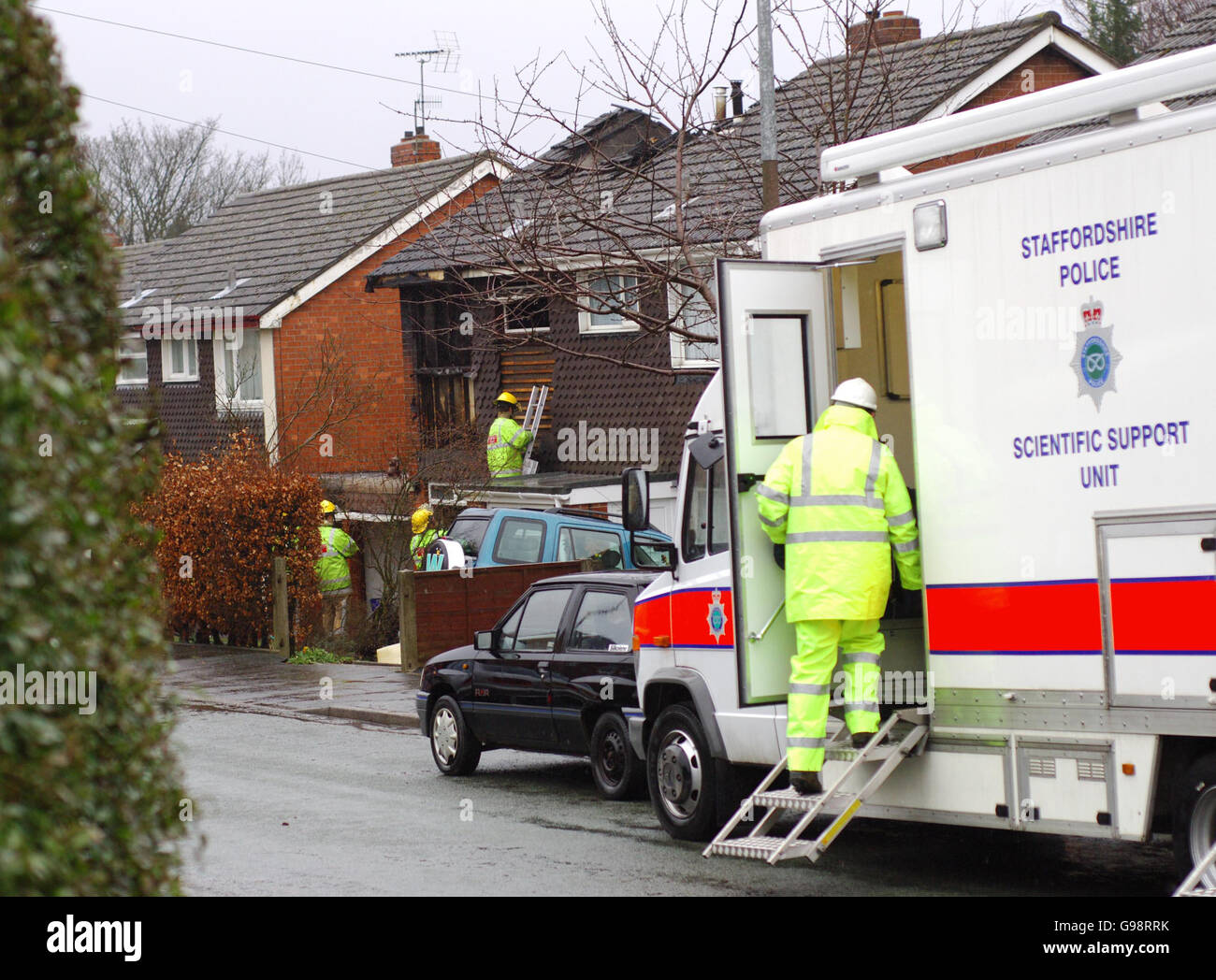 Emergency service personnel at the house Friday March 10, 2006, in ...