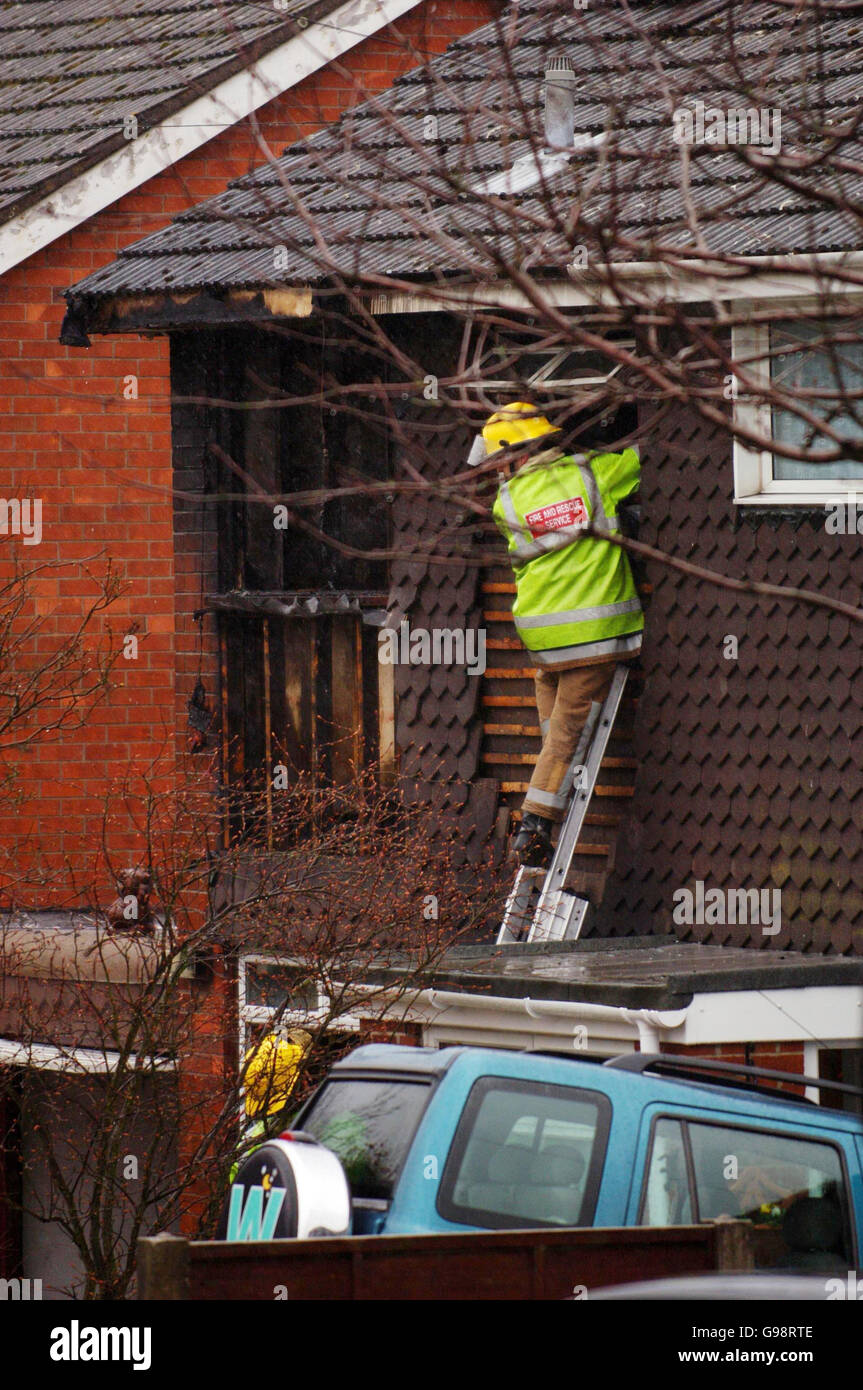 Emergency service personnel at the house Friday March 10, 2006, in ...