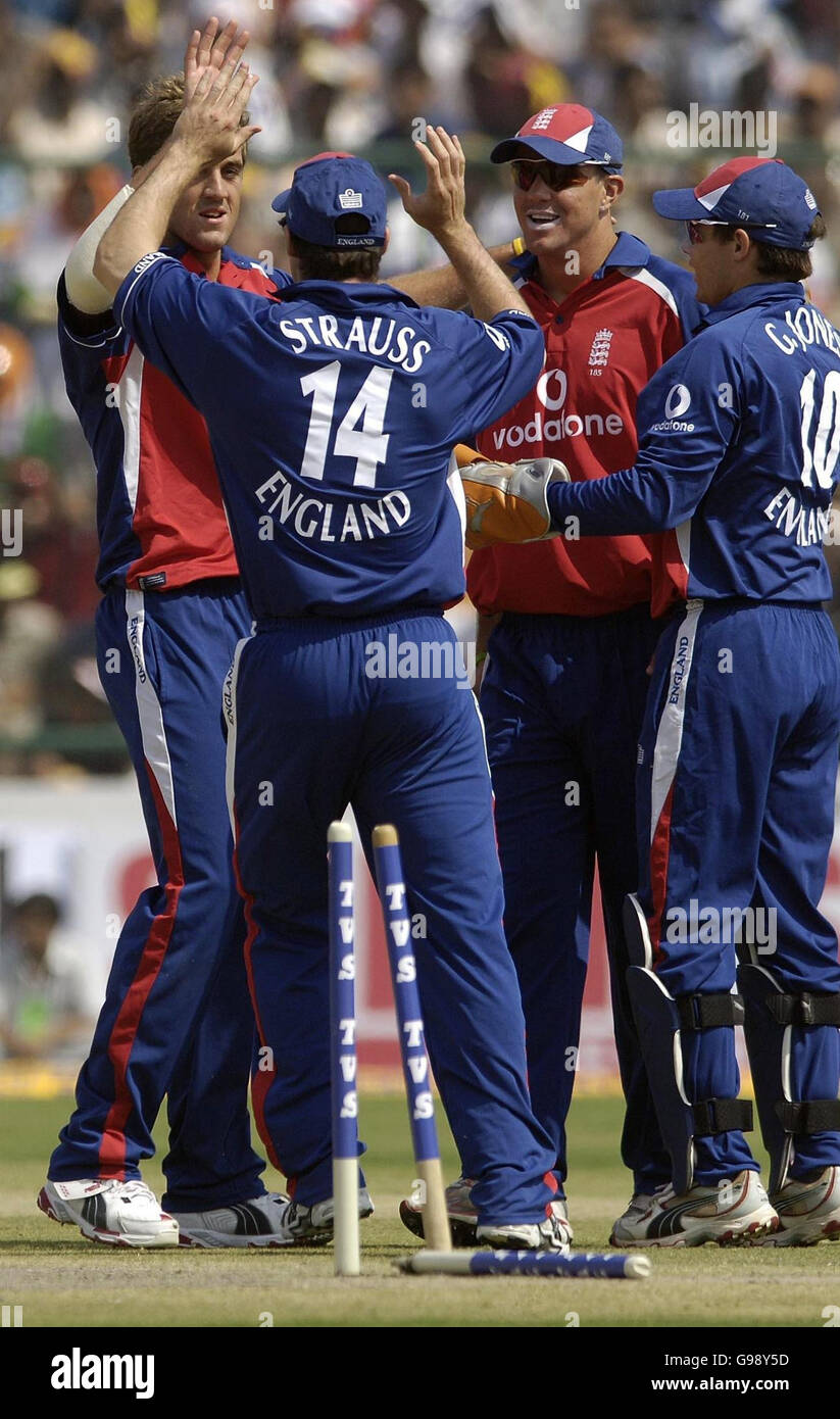 England bowler Liam Plunkett (L) celebrates taking the wicket of Indian ...