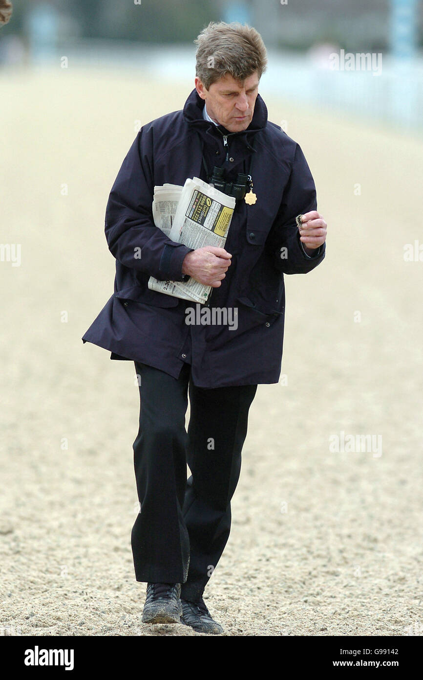 Horse Racing - Kempton Park. Racing journalist Brough Scott walks the ...