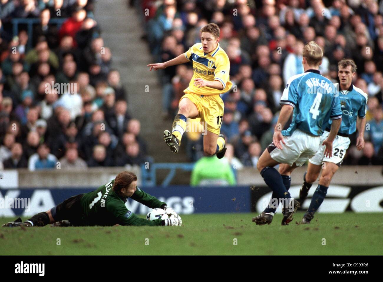 Manchester City goalkeeper Nicky Weaver (left) saves from Leeds United ...