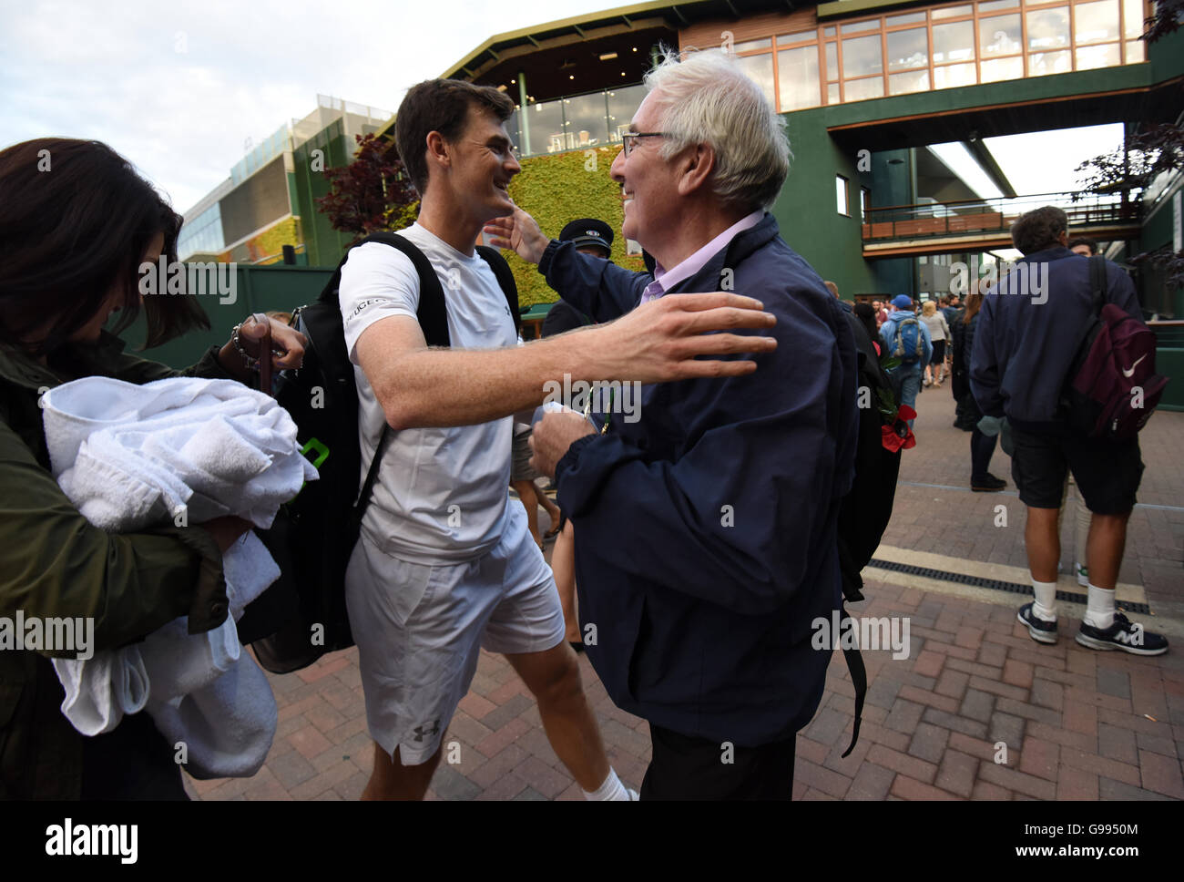 Jamie Murray is greeted by a friend following his doubles match during ...