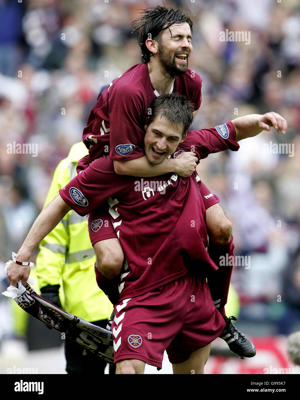 Hearts' Paul Hartley (top) celebrates with team-mate Rudi Skacel after ...