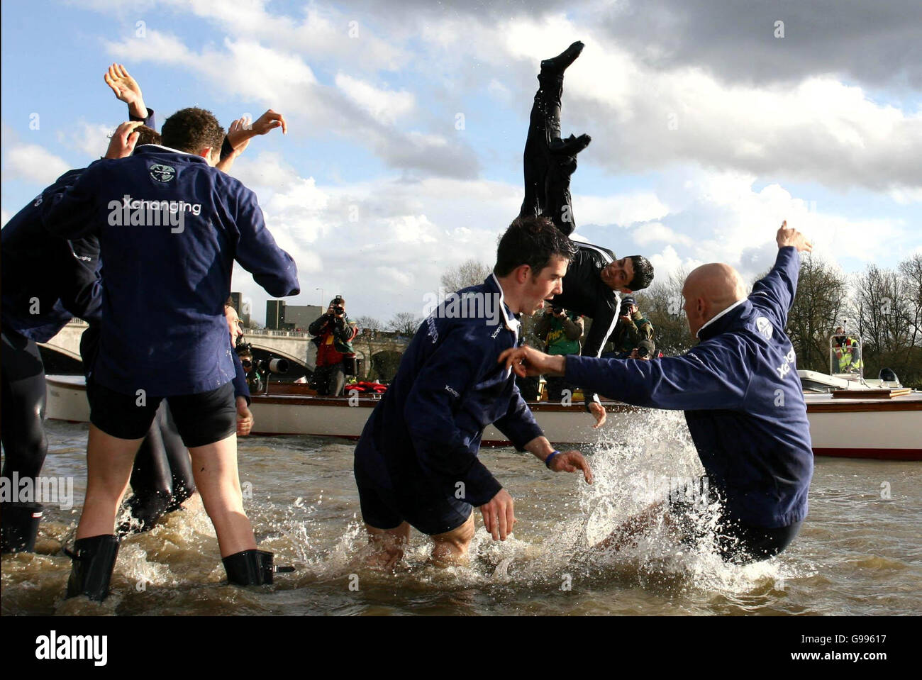 Oxford crew members throw cox Seb Pierce into the Thames after their ...