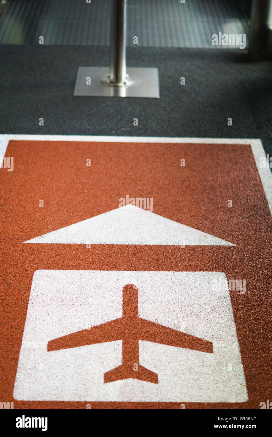 Airplane sign painted on the floor - airport sign Stock Photo - Alamy