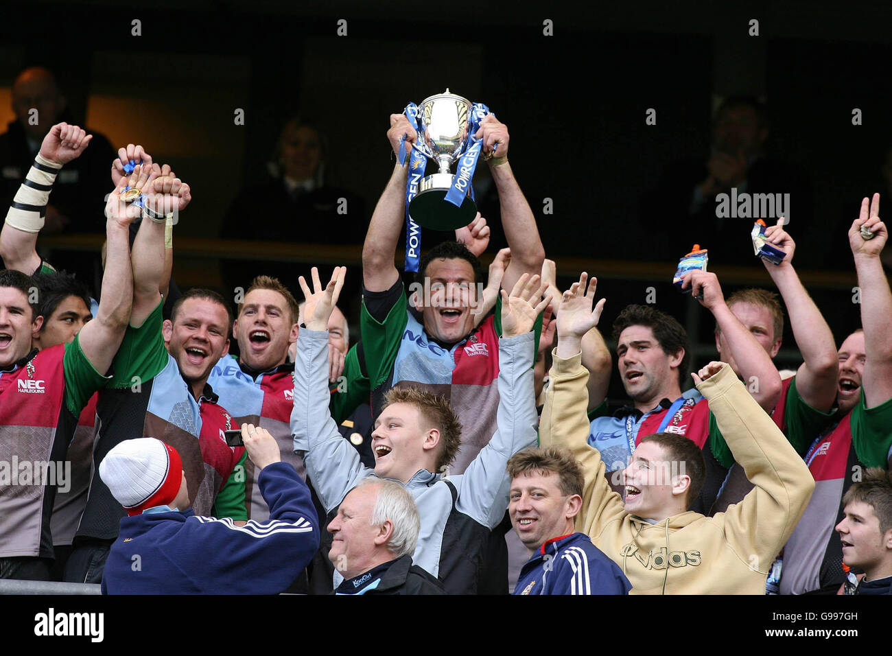 Harlequins' captain Andre Vos lifts the trophy after beating Bedford in ...