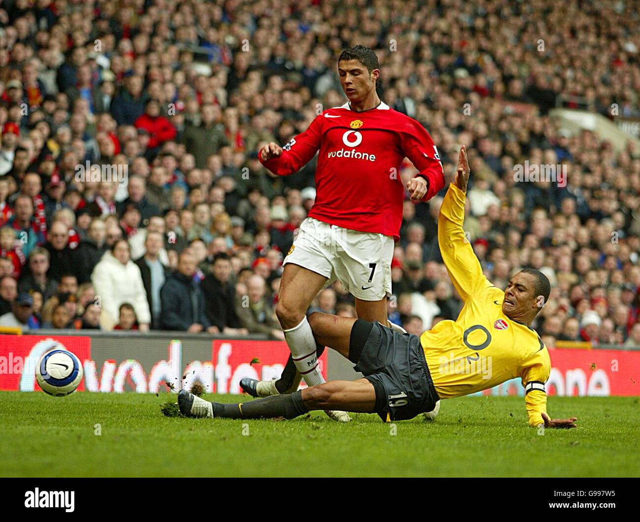 Manchester United's Cristiano Ronaldo is tackled by Arsenal's Gilberto ...